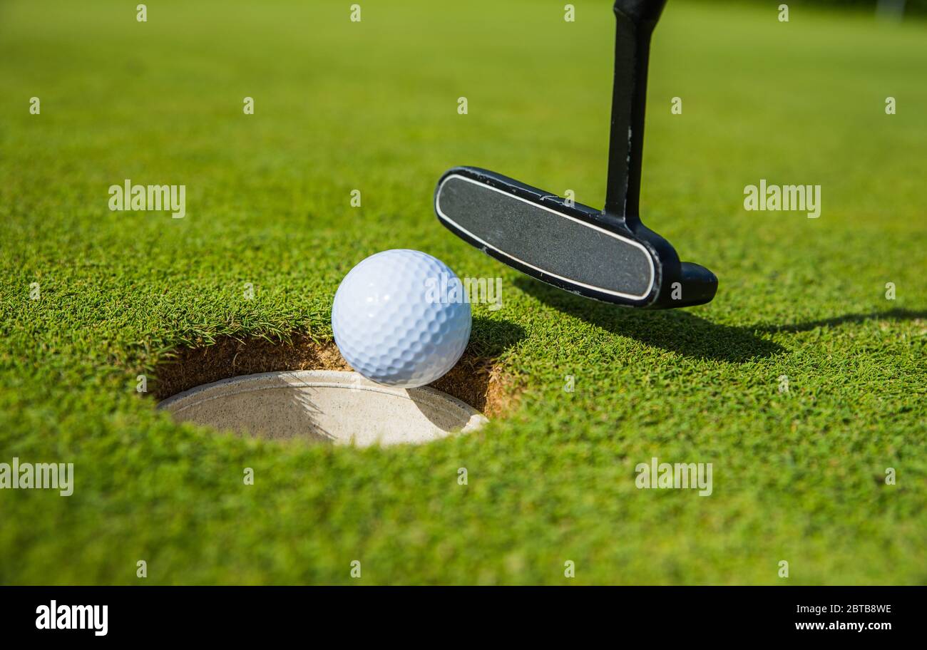 golf ball ang club on golf green grass natural fairway Stock Photo - Alamy