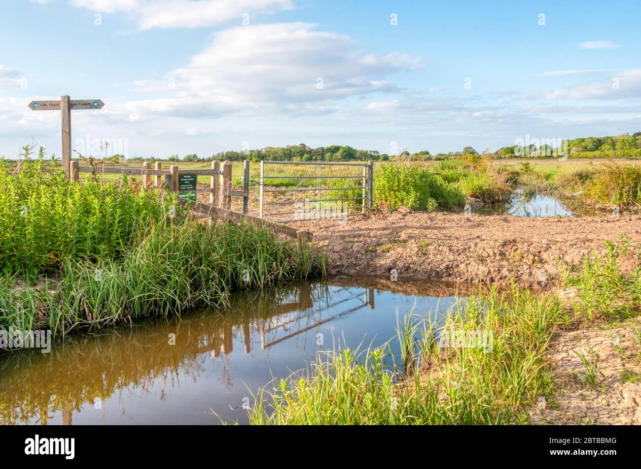 A footpath across reclaimed wetlands on the east shores of The Wash in ...