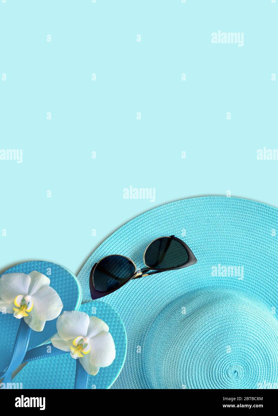 Summer hat with sunglasses. Top view, minimal concept over a blue ...
