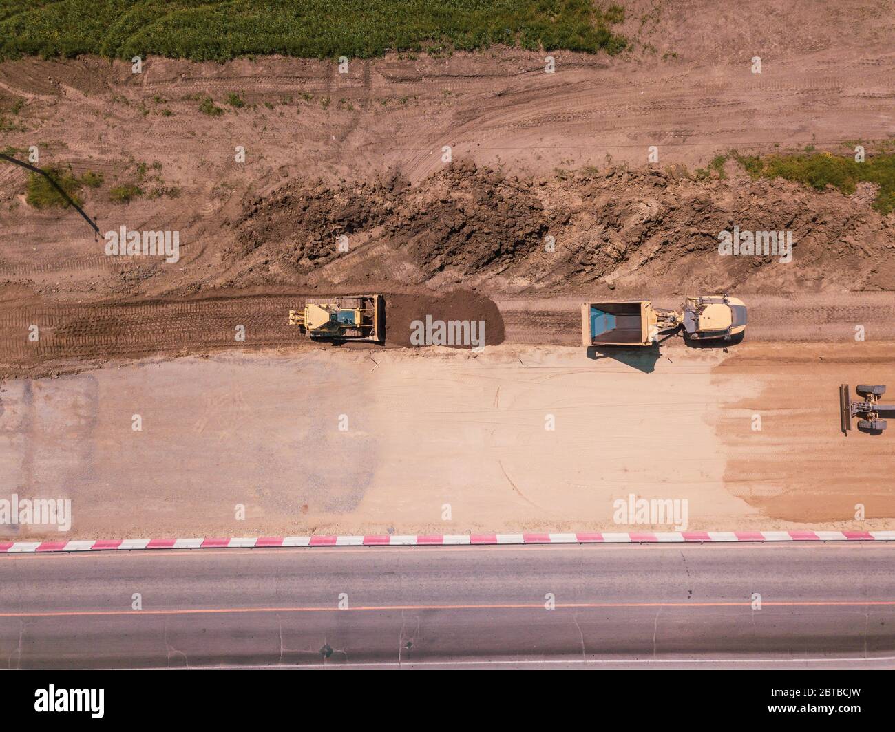 Aerial construction site with machinery, bulldozer, excavation. Top ...