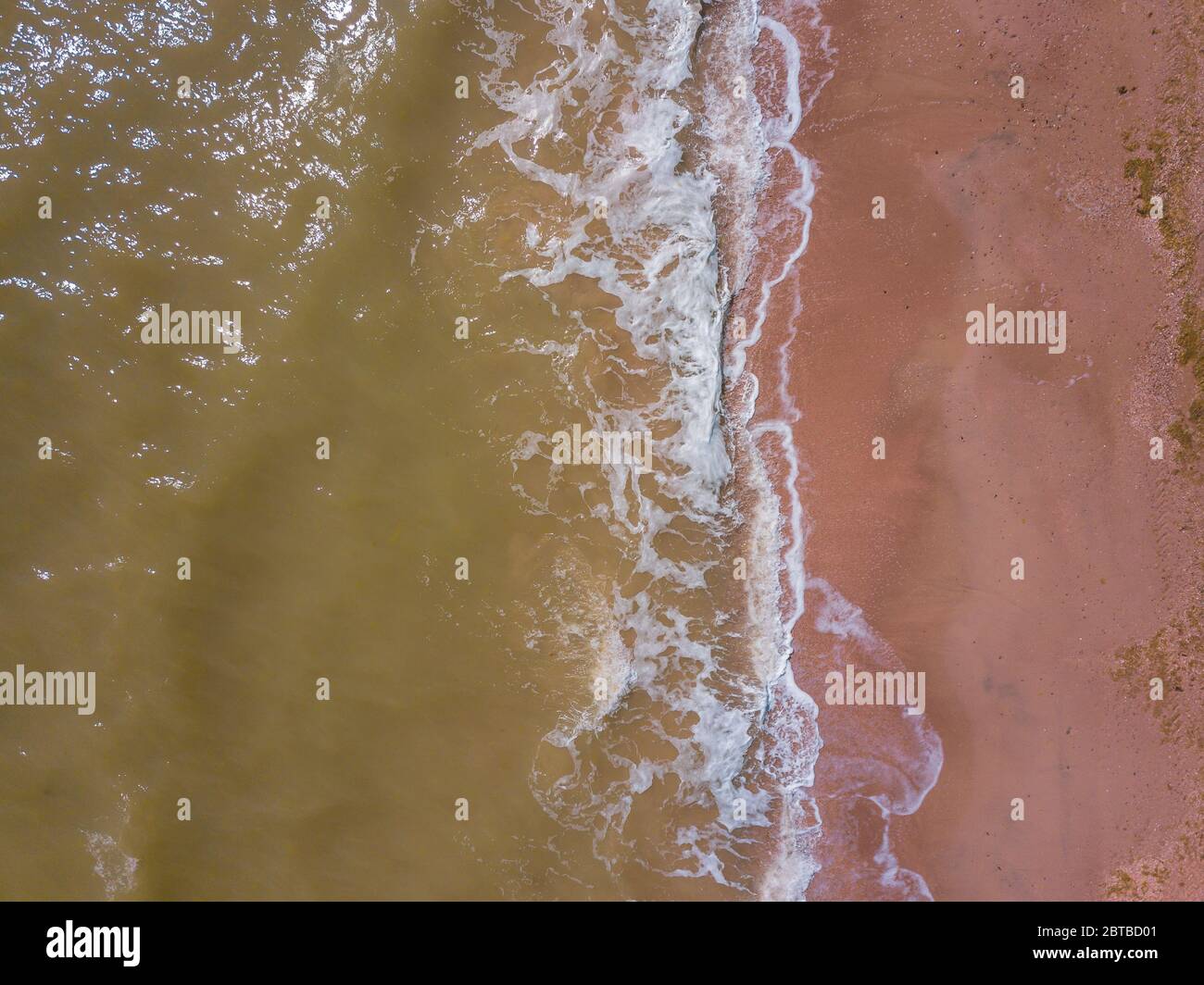 Aerial view of ocean waves crashing on beach 4k footage. Top Down ...
