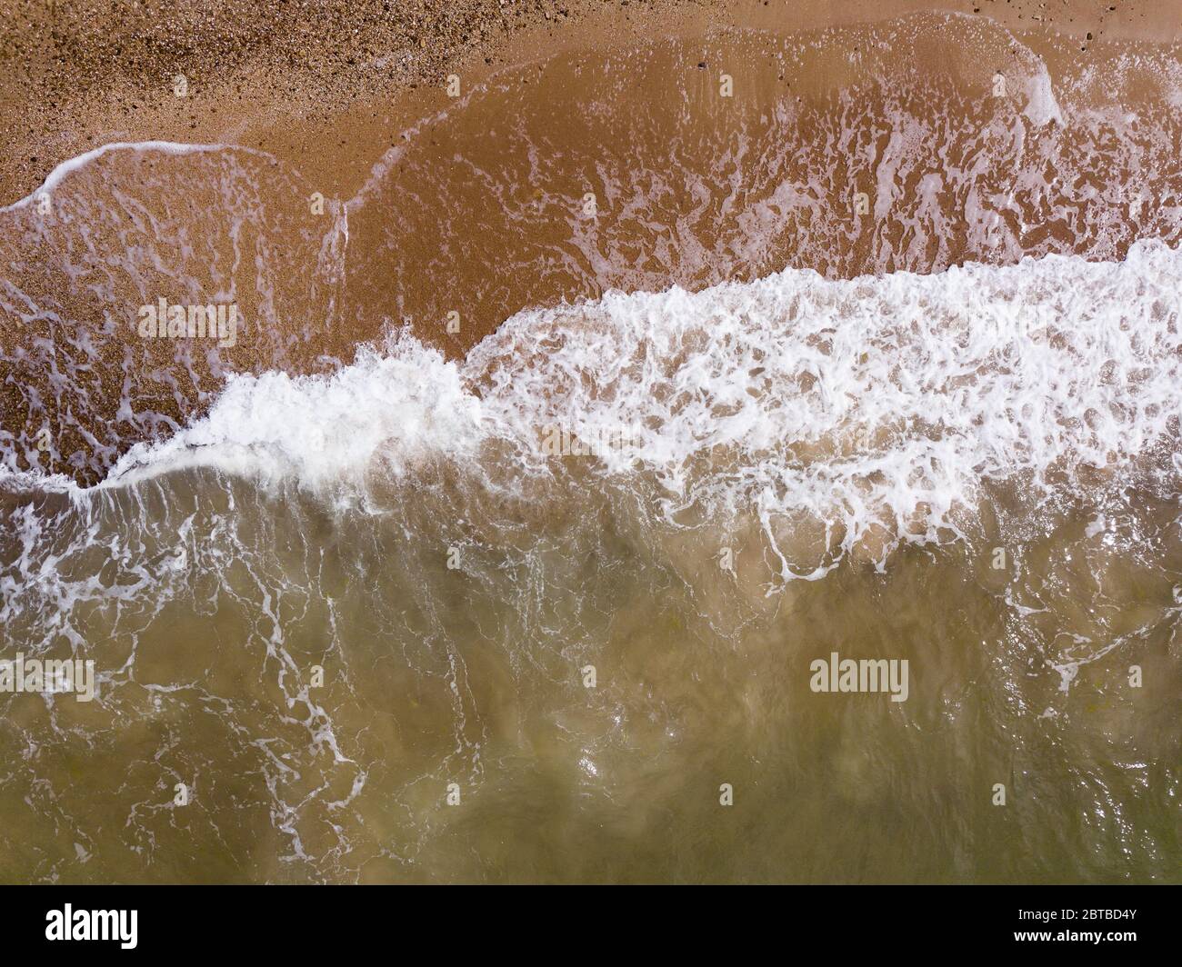 Aerial view of ocean waves crashing on beach 4k footage. Top Down ...