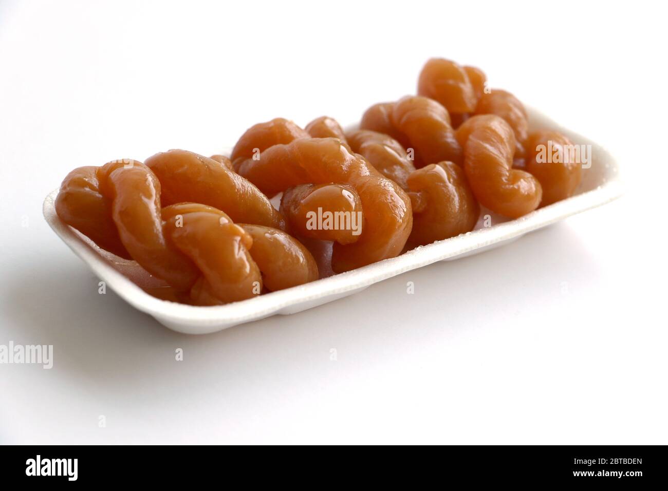 Traditional South African sticky koeksisters isolated on white in a ...