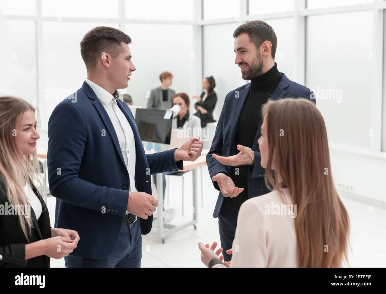 business people discuss something standing in the office Stock Photo ...
