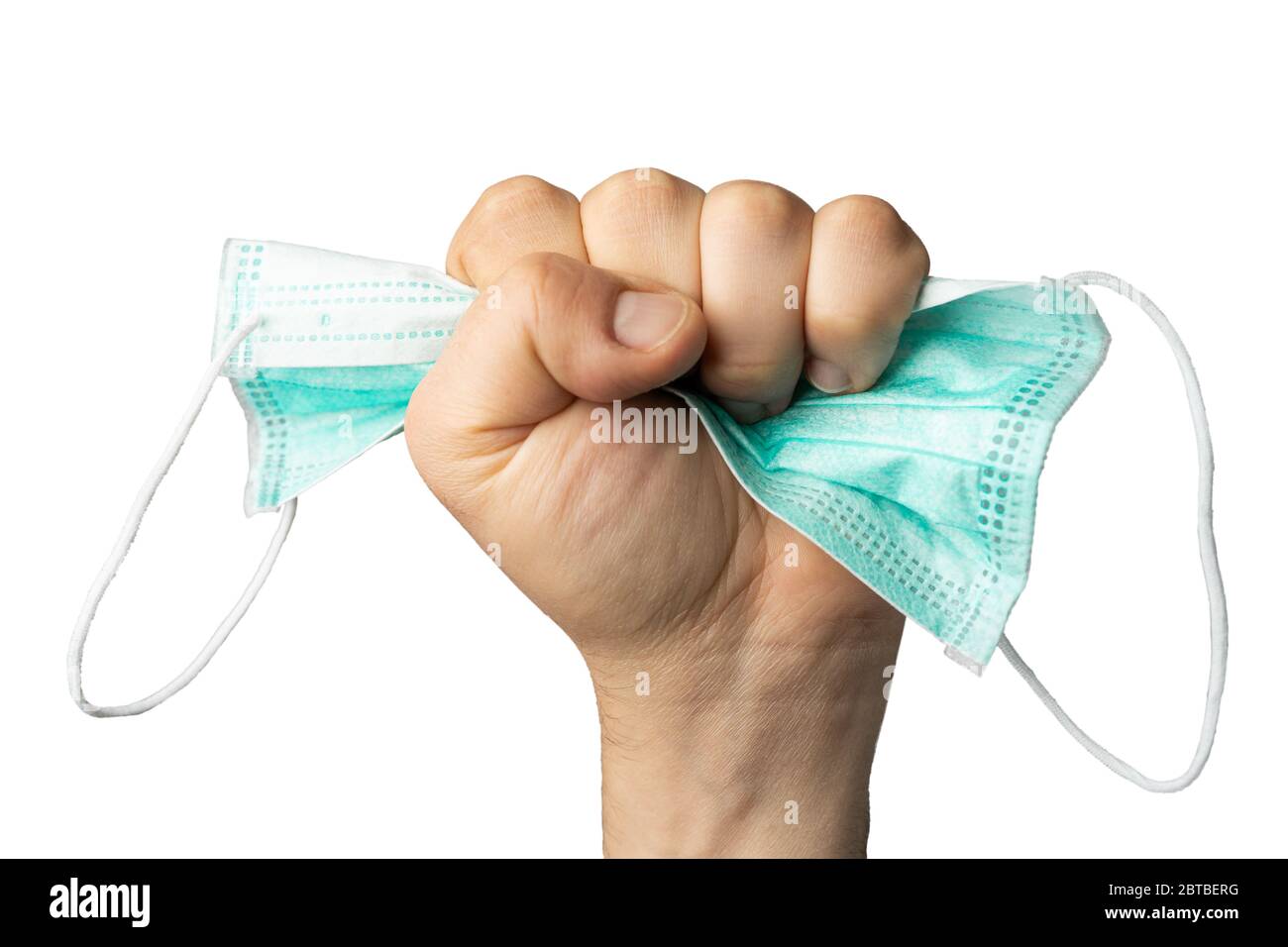 Caucasian man holding crushed protective face mask in a hand. End of ...