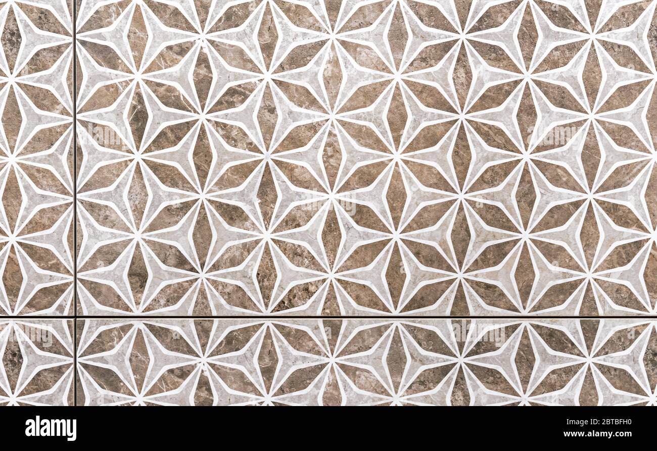 Beige porcelain tiles with ornament. Background and texture of ...