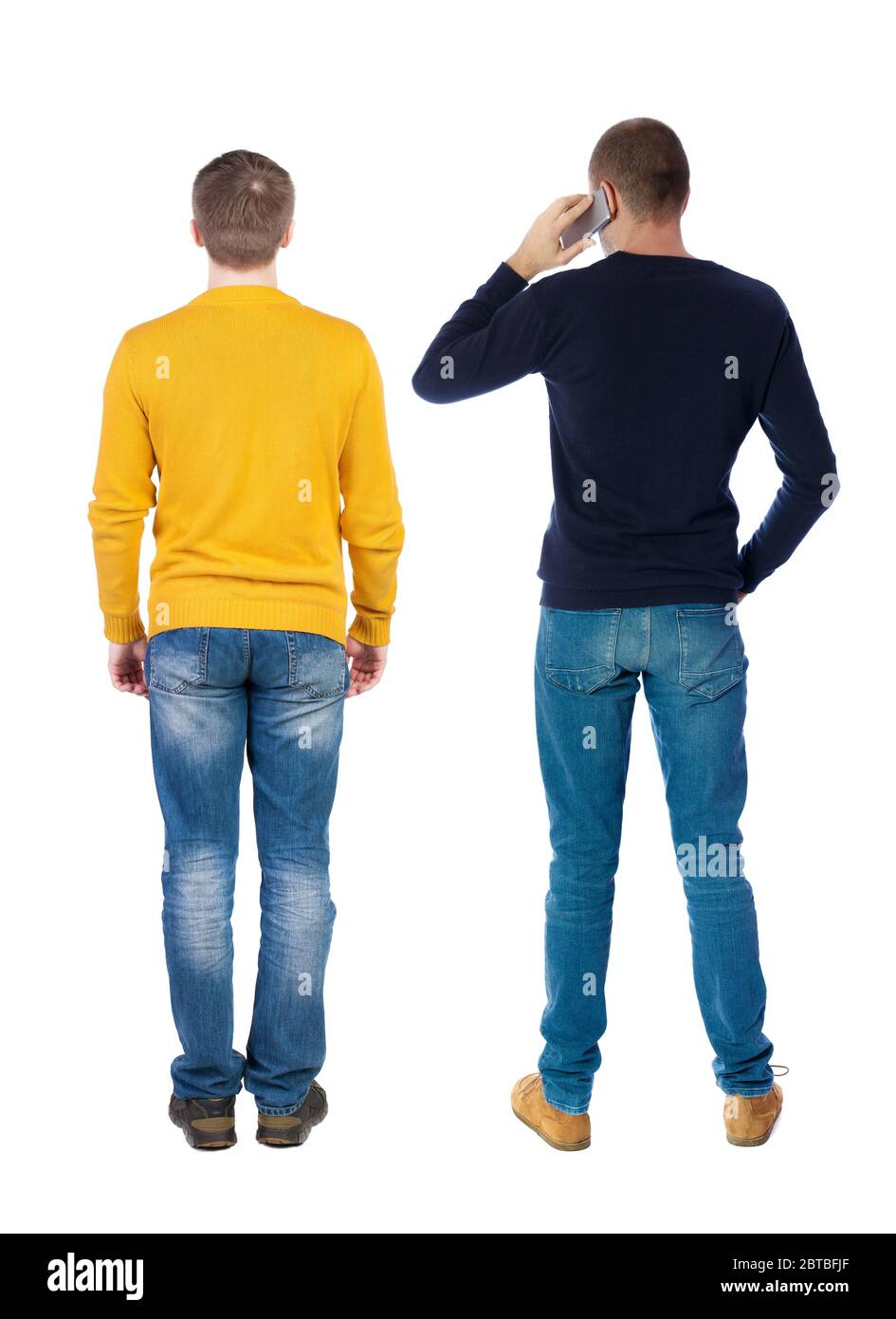 Back view of two man in sweater with mobile phone. Rear view people ...