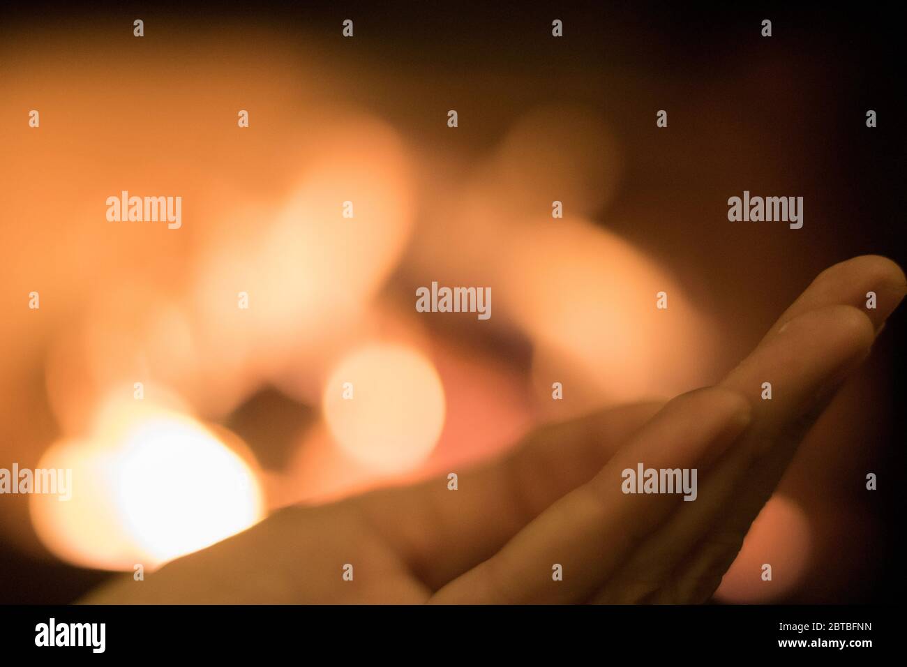 hand and fire Stock Photo - Alamy