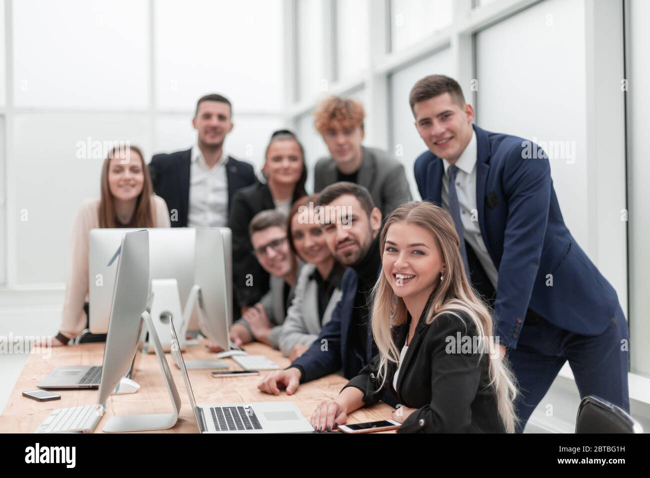 large group of employees in the workplace in the office Stock Photo - Alamy
