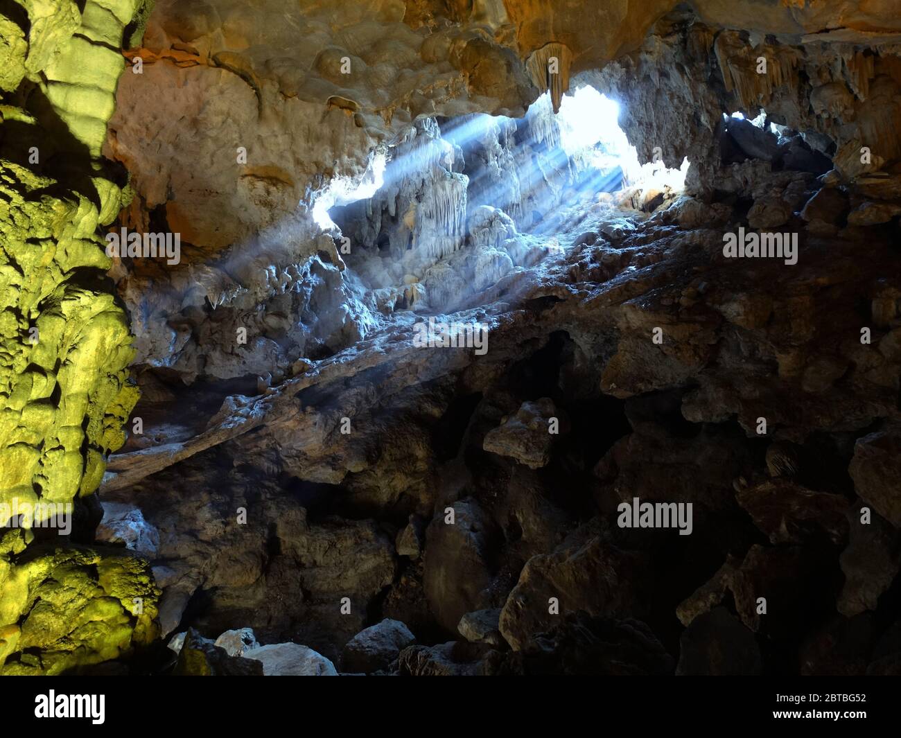Rays of light entering in a cave Stock Photo - Alamy