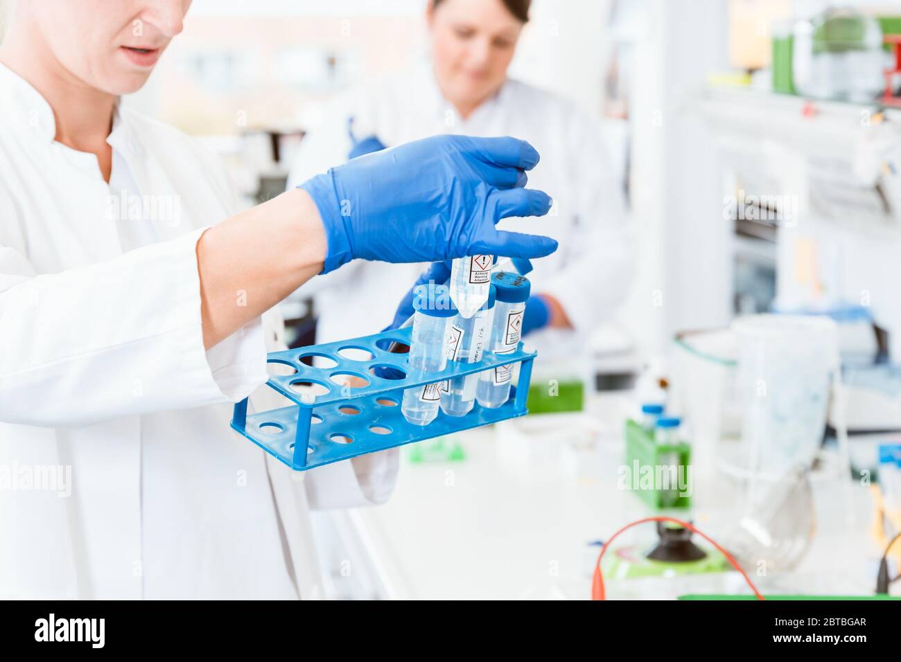 Scientist holding test tube vaccine hi-res stock photography and images ...