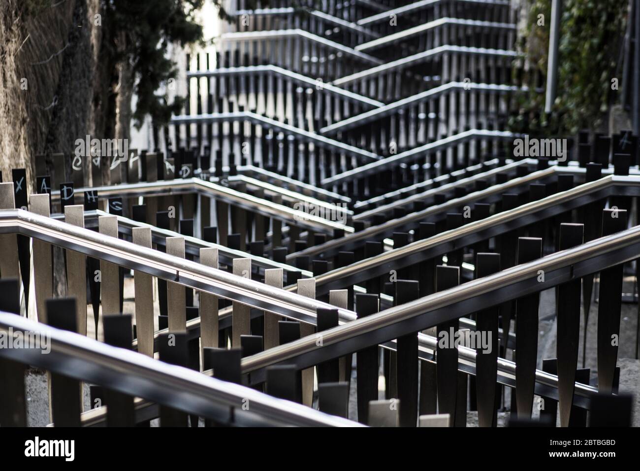 A row of railings in the street urban picture Stock Photo - Alamy