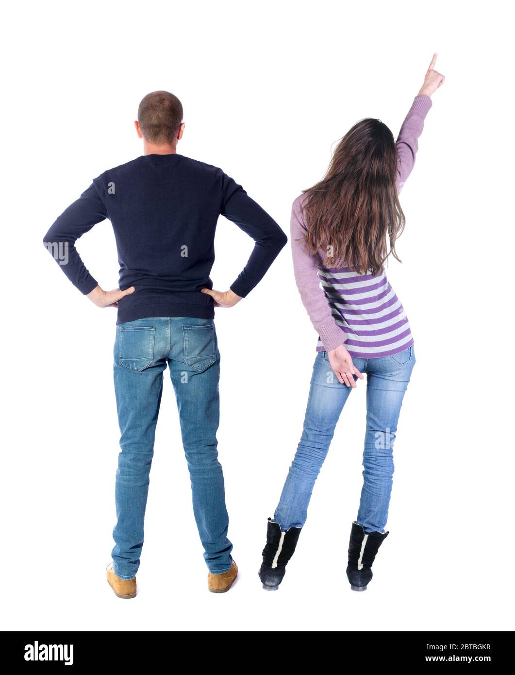 Back view of couple in sweater with mobile phone. beautiful friendly ...
