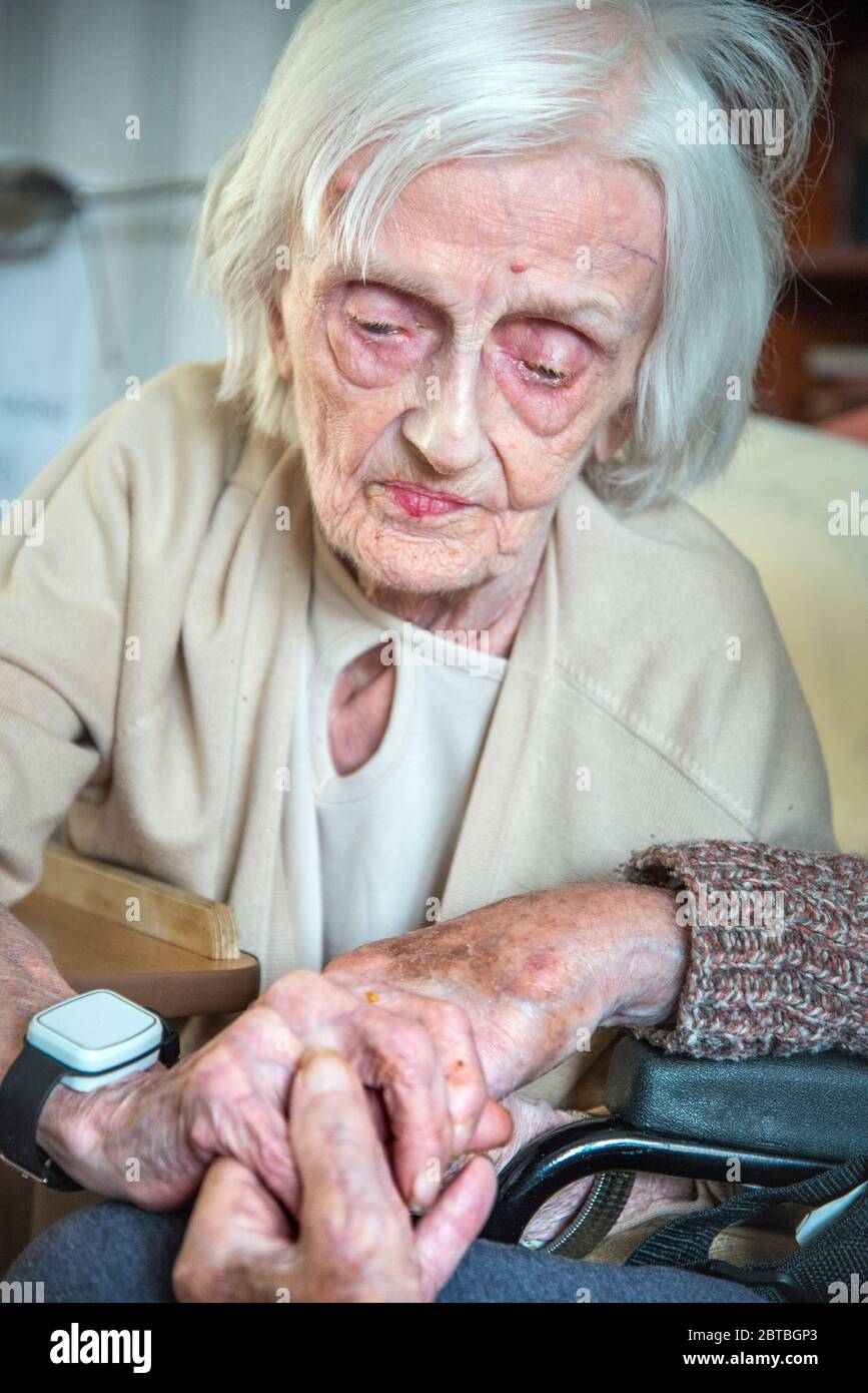 Woman clasping hands hi-res stock photography and images - Alamy