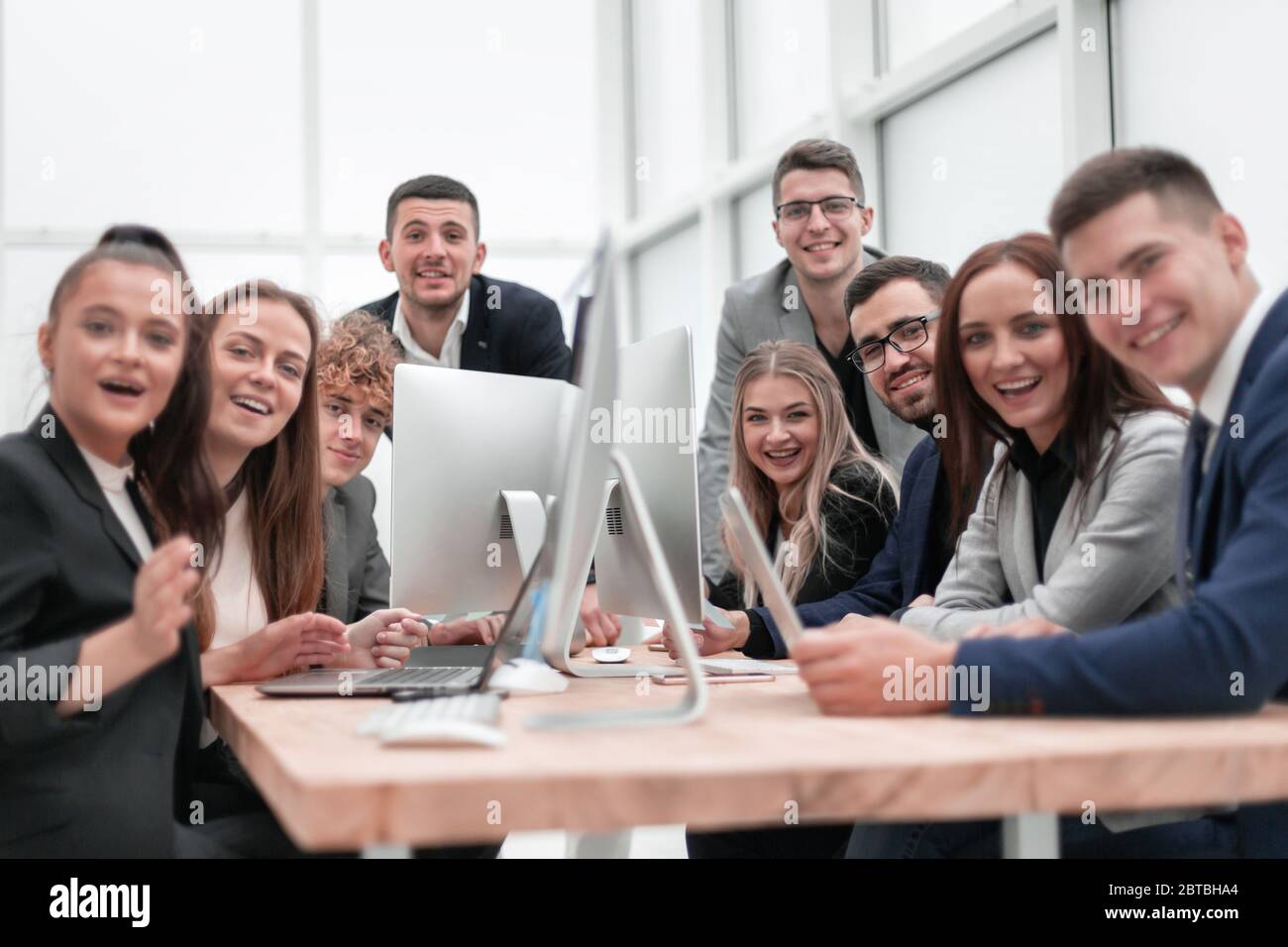 professional young employees sitting together at the office Desk Stock ...