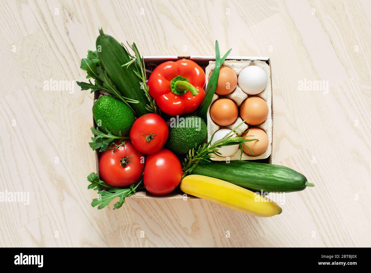 Fresh vegetables in a cardboard box. Fast delivery right from the store ...