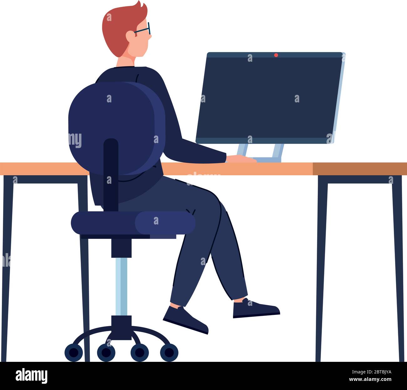 young man using desktop computer, sitting in chair with desk Stock ...