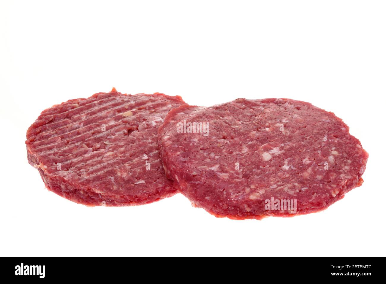 Raw meat beef burgers viewed from above - white background Stock Photo ...