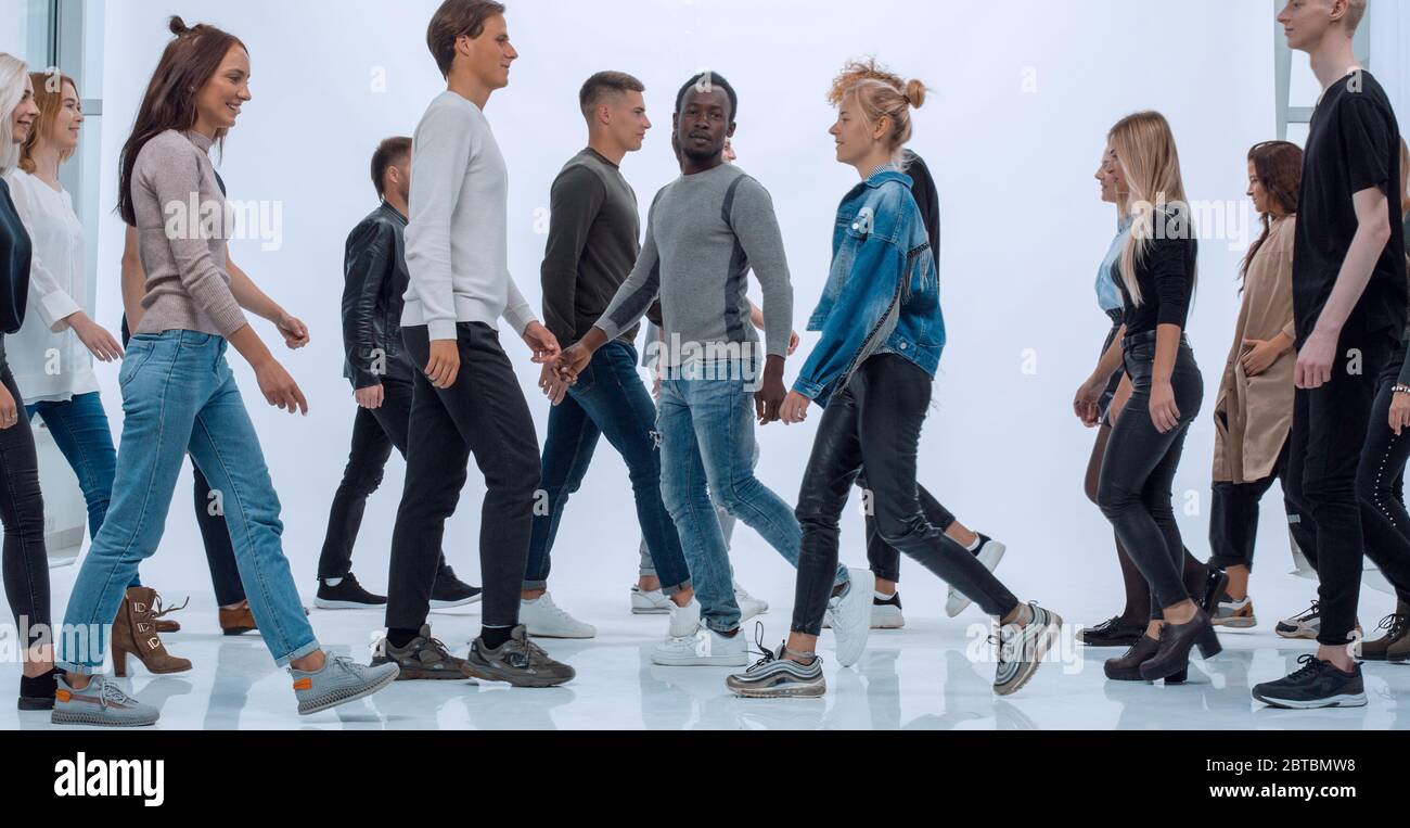 casual young people walking in different directions Stock Photo - Alamy