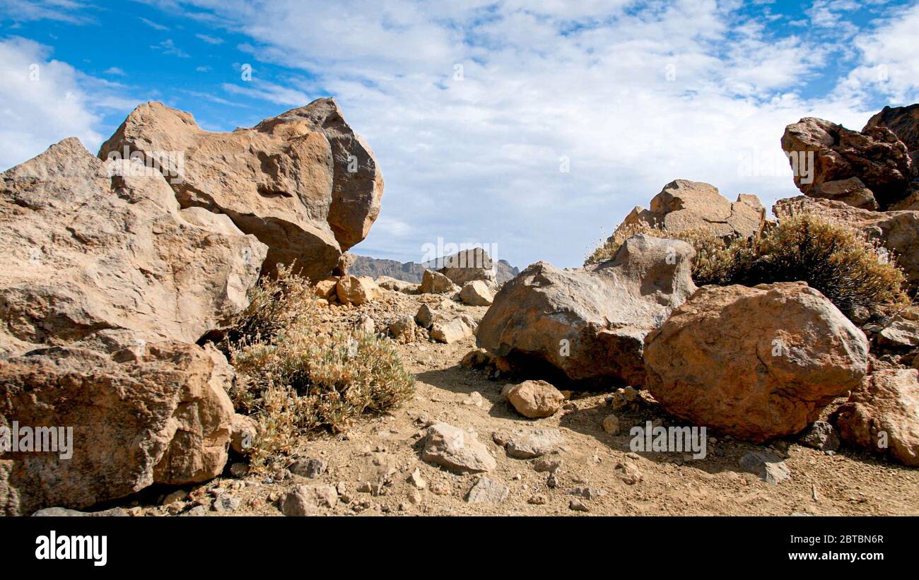 Big rocks and boulders in the rocky desert against blue sky Stock Photo ...