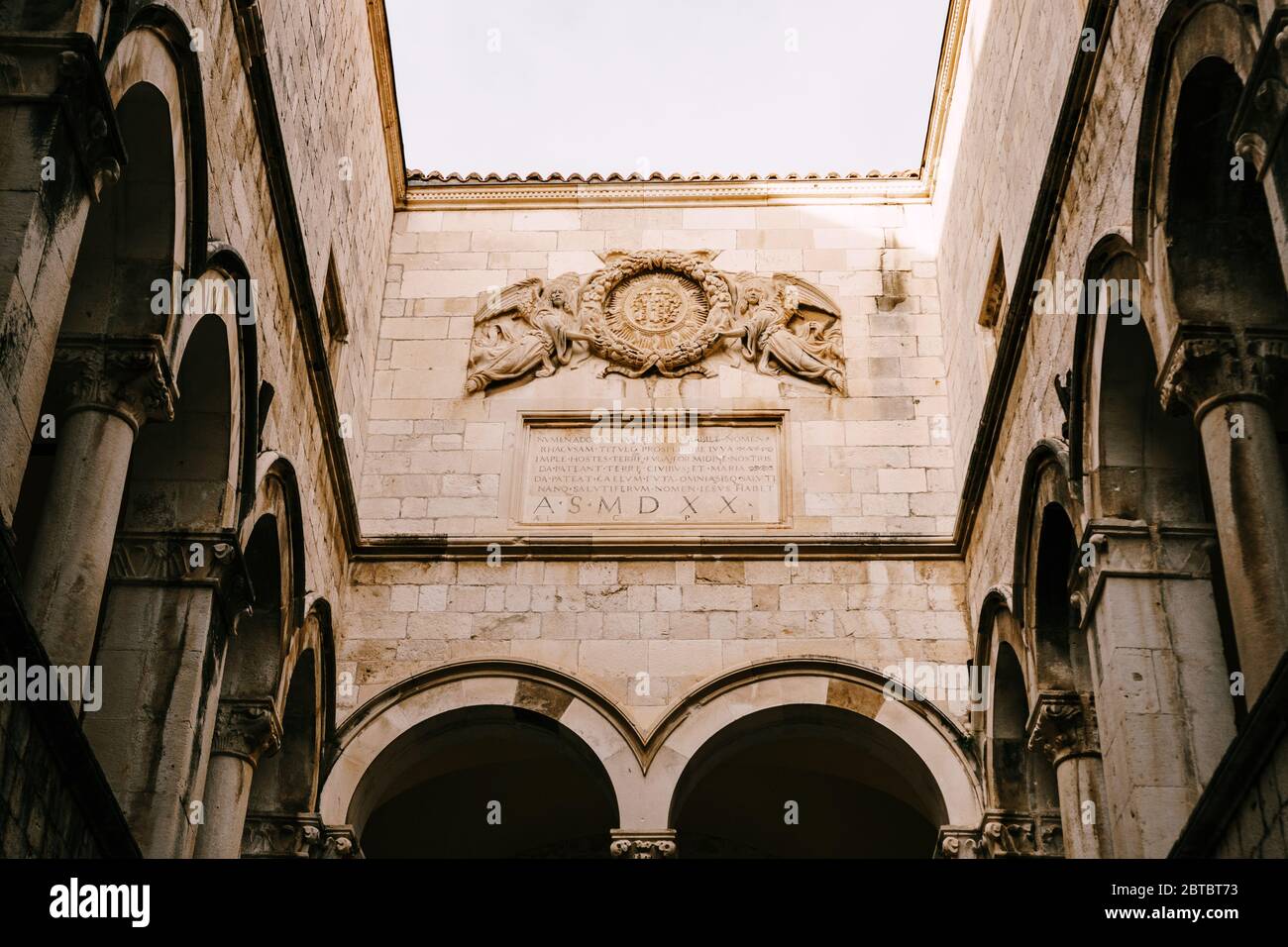 The interior of the Sponza Palace in Dubrovnik, Croatia. Courtyard with ...