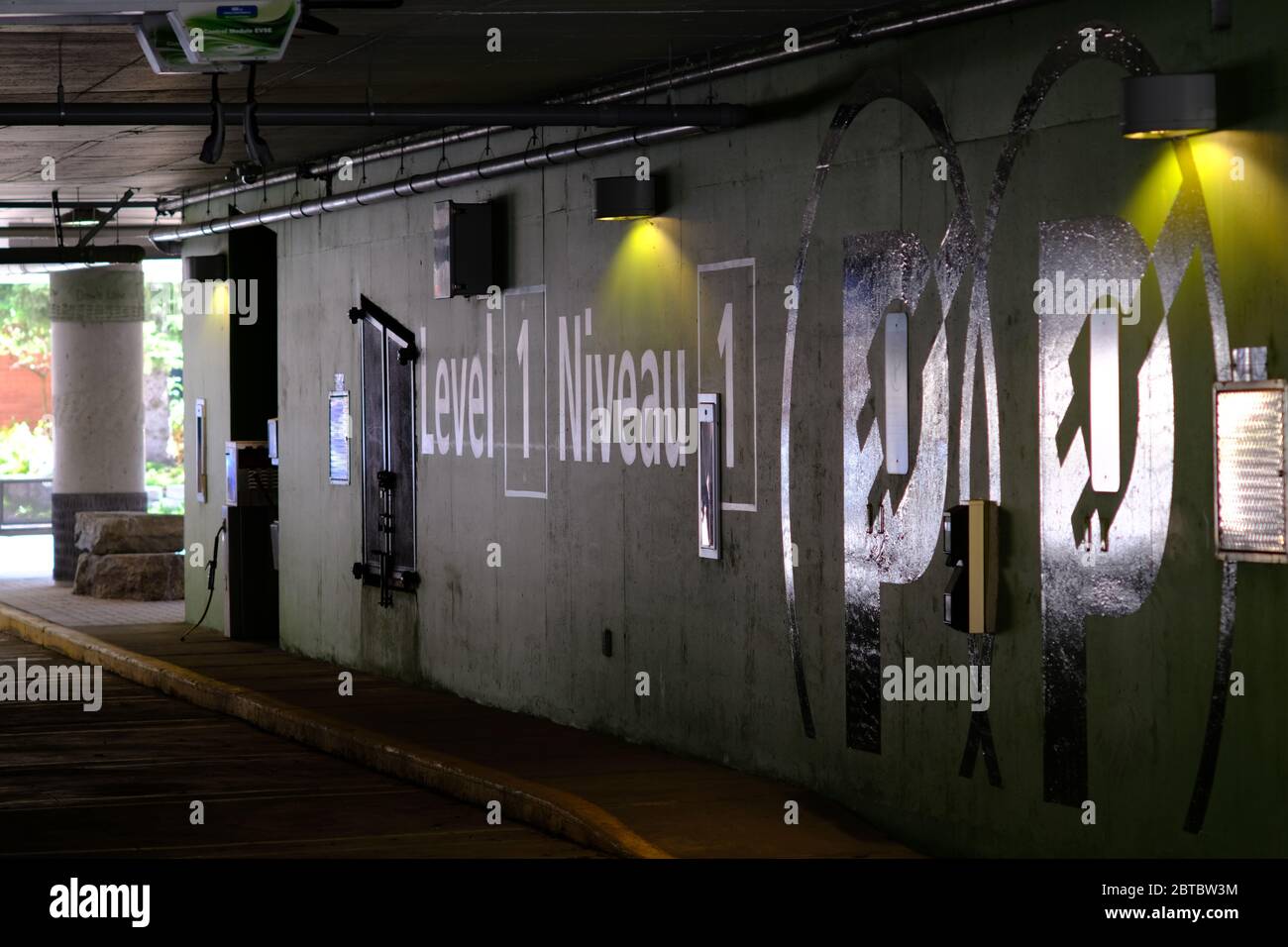 Dim yellow lighting highlights the Level 1 sign on the first (ground ...