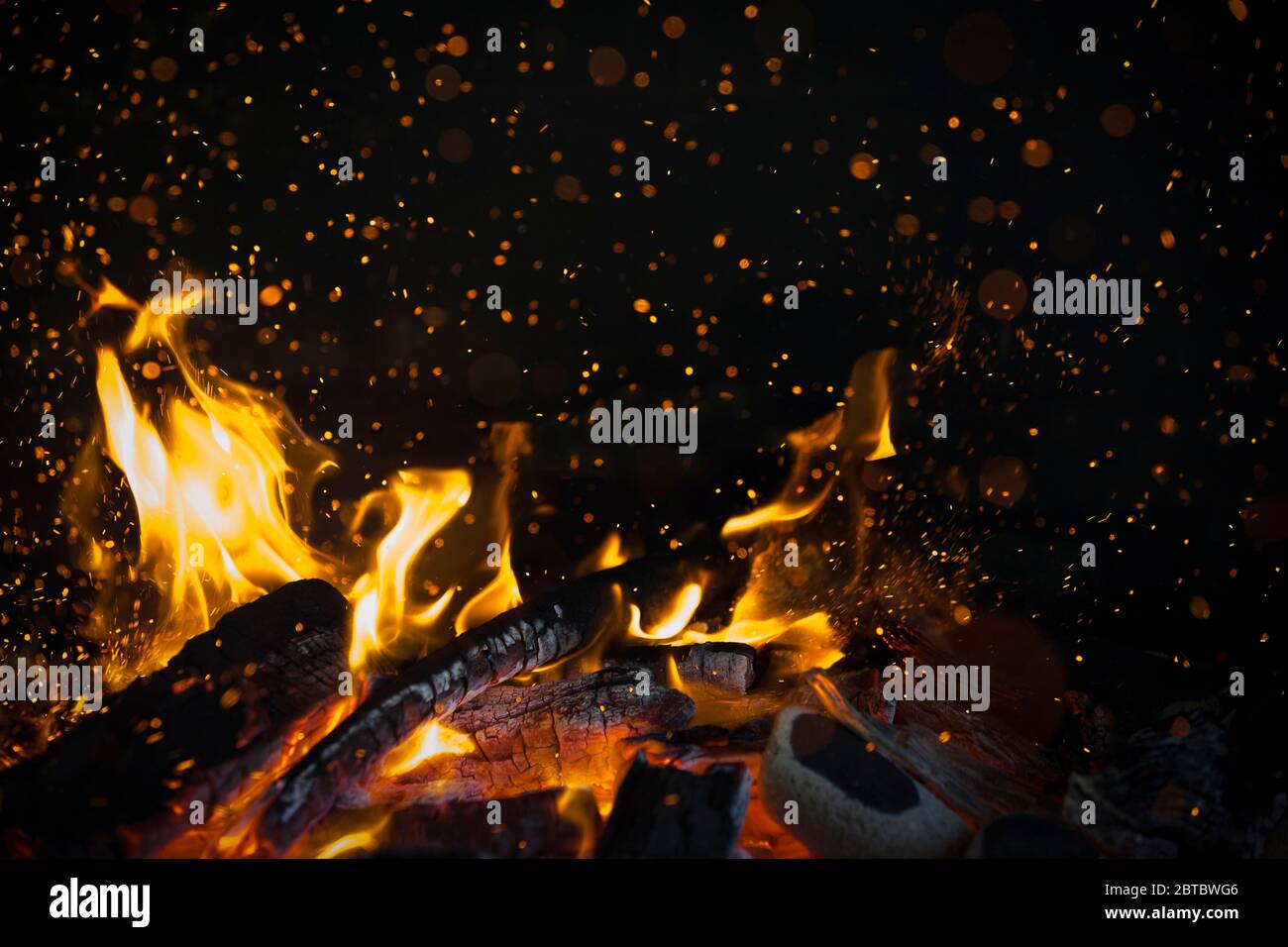 Yellow and Orange Fireball, heating up the black background Stock Photo ...