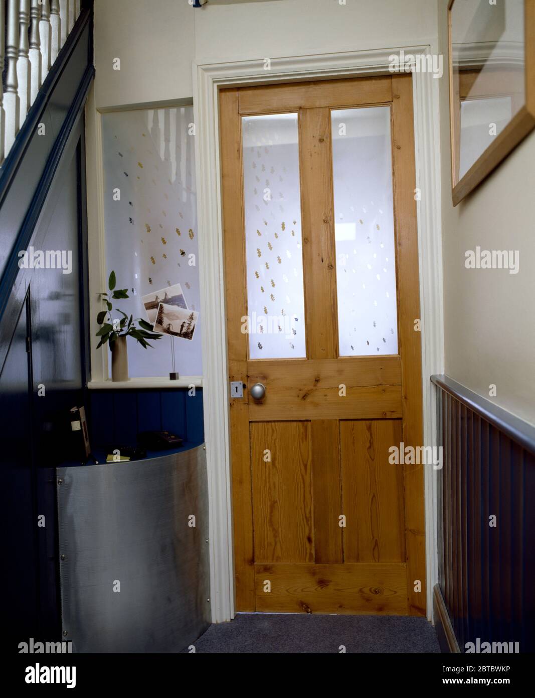 Home made zinc covered corner cupboard in hall Stock Photo - Alamy
