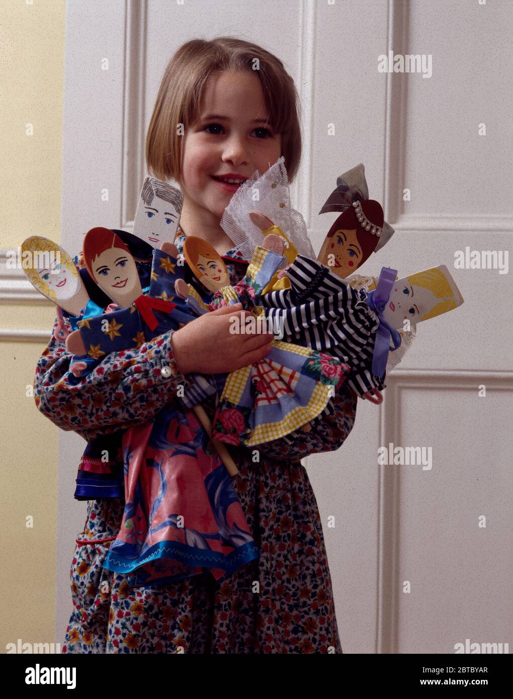 Small girl holding home made puppets EDITORIAL USE ONLY EDITORIAL USE ...
