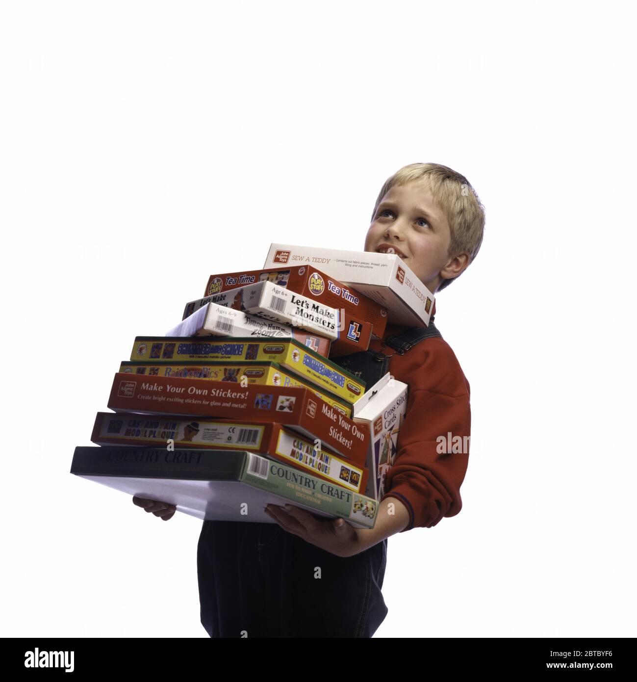 Boy carrying boxes hi-res stock photography and images - Alamy