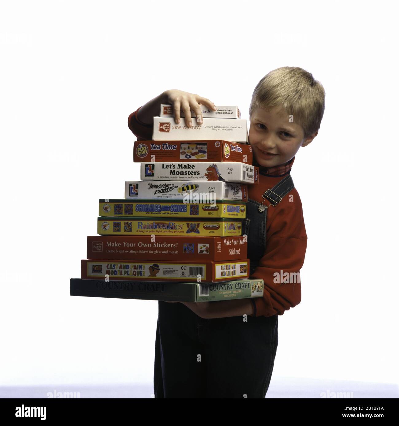 Boy carrying boxes hi-res stock photography and images - Alamy