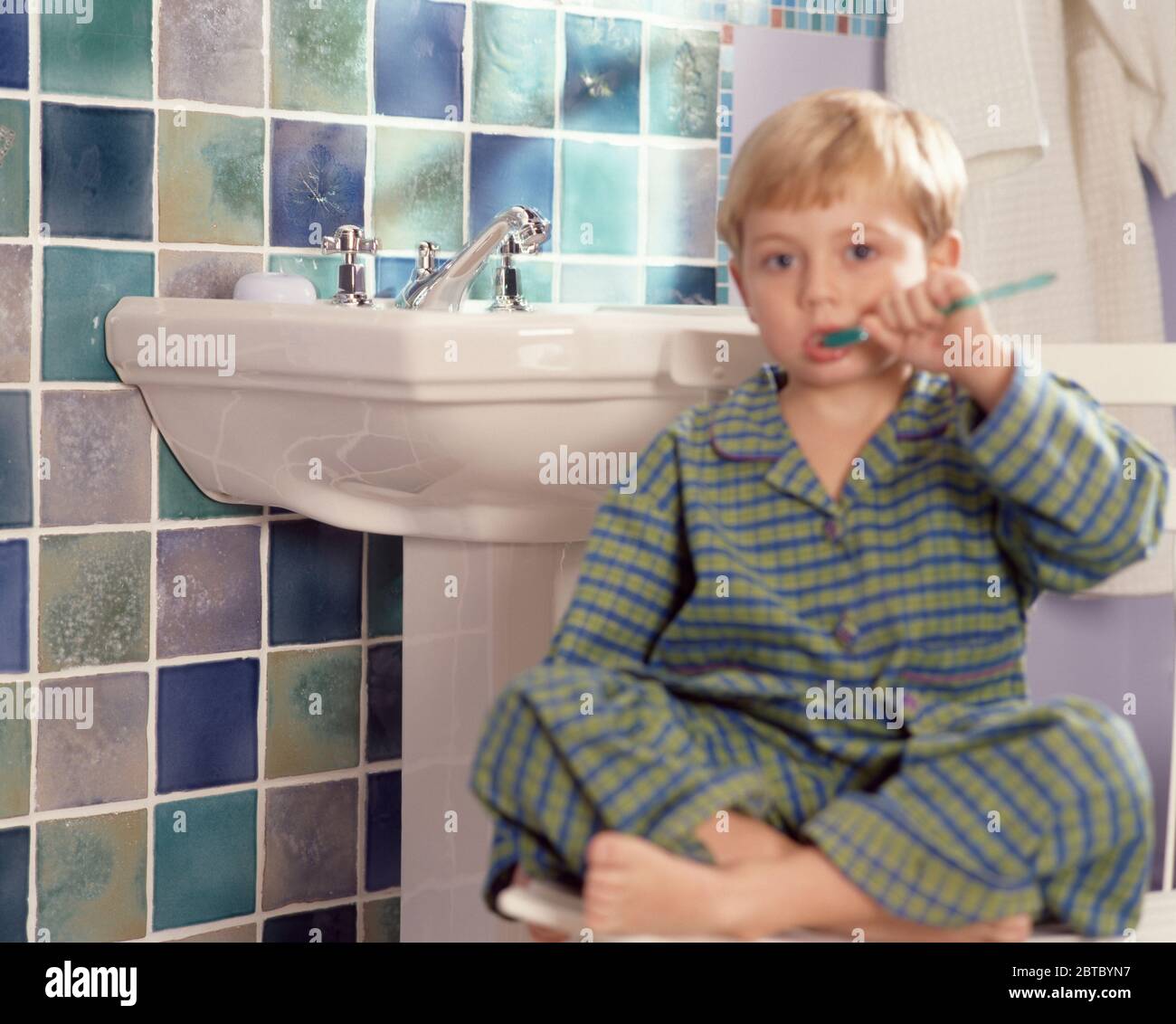 Small boy brushing his teeth EDITORIAL USE ONLY EDITORIAL USE ONLY ...