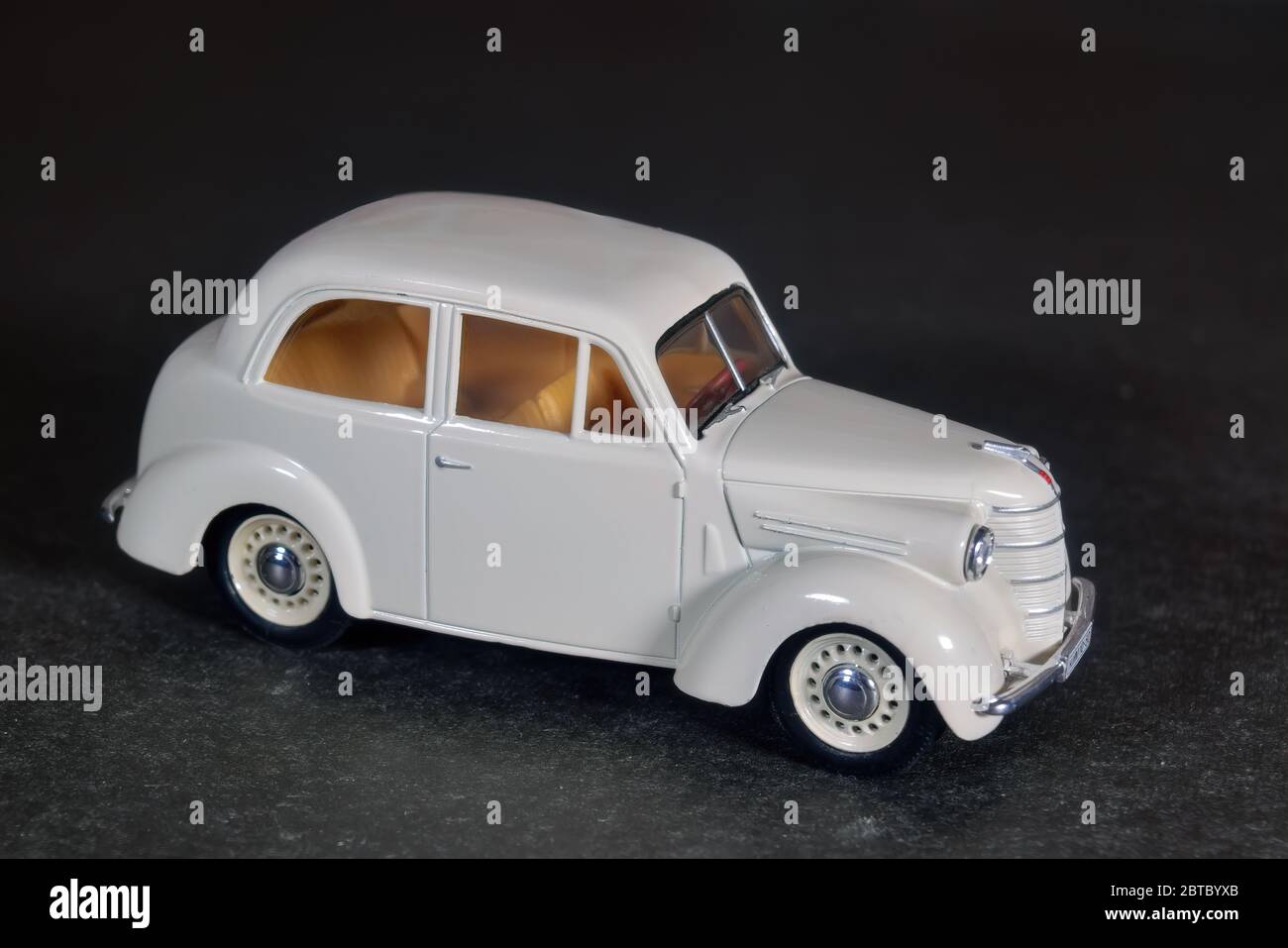 Children's toy car white on a dark background Stock Photo - Alamy