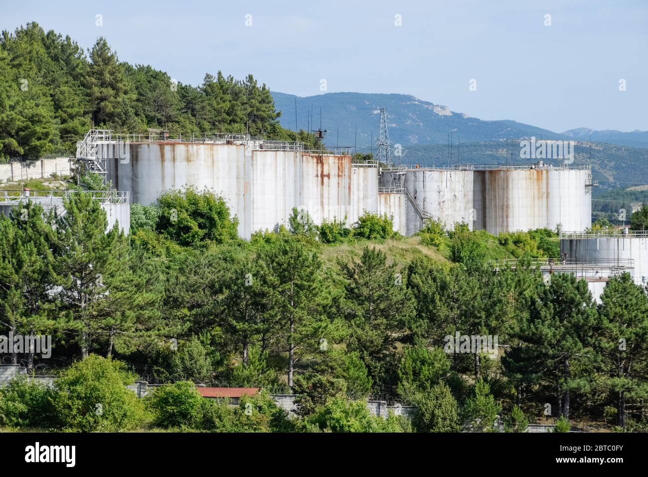 Oil storage tanks at the oil depot. reservoir vertical steel Stock ...