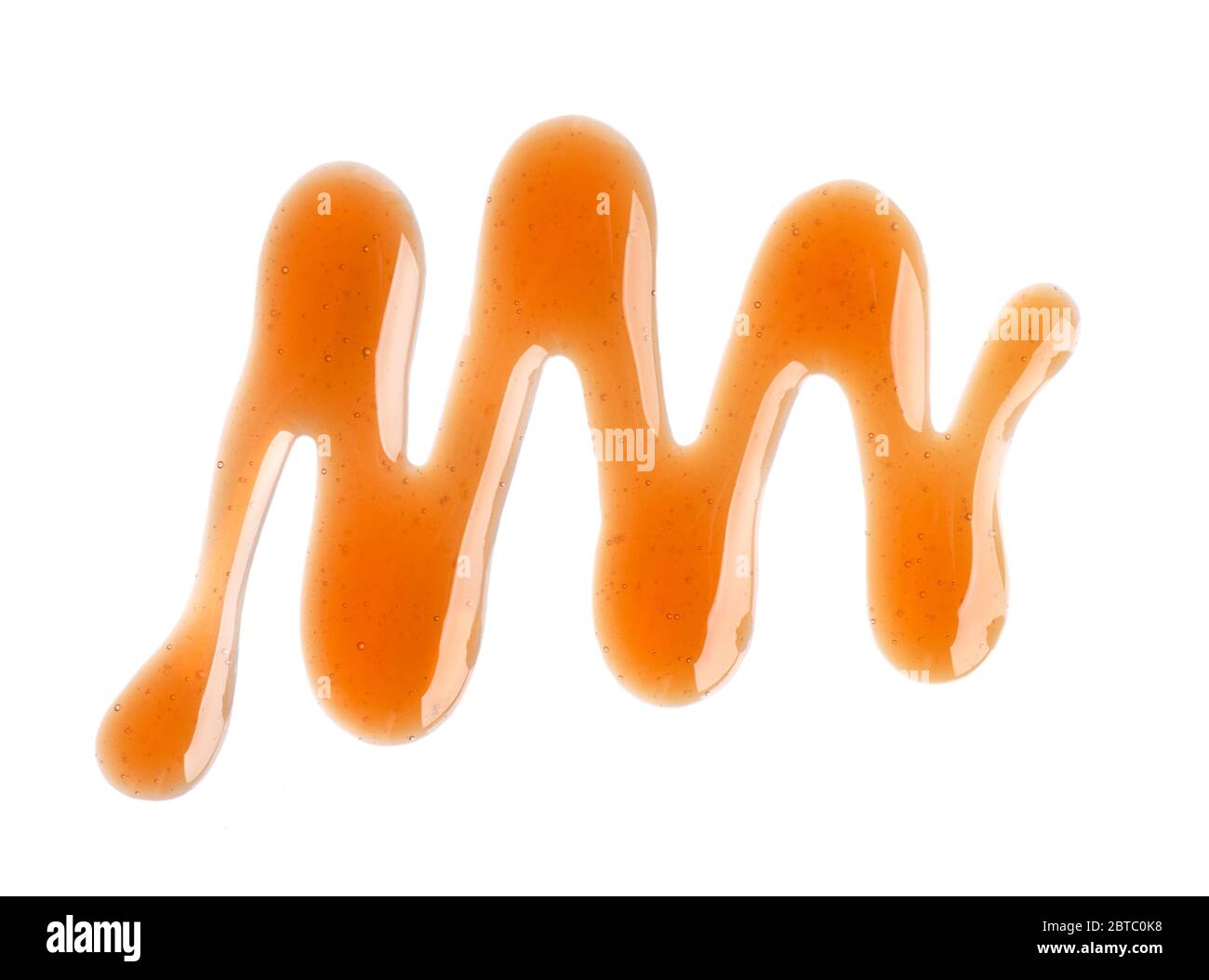 Caramel Syrup Drizzle Isolated On White Background Splashes Of Sweet