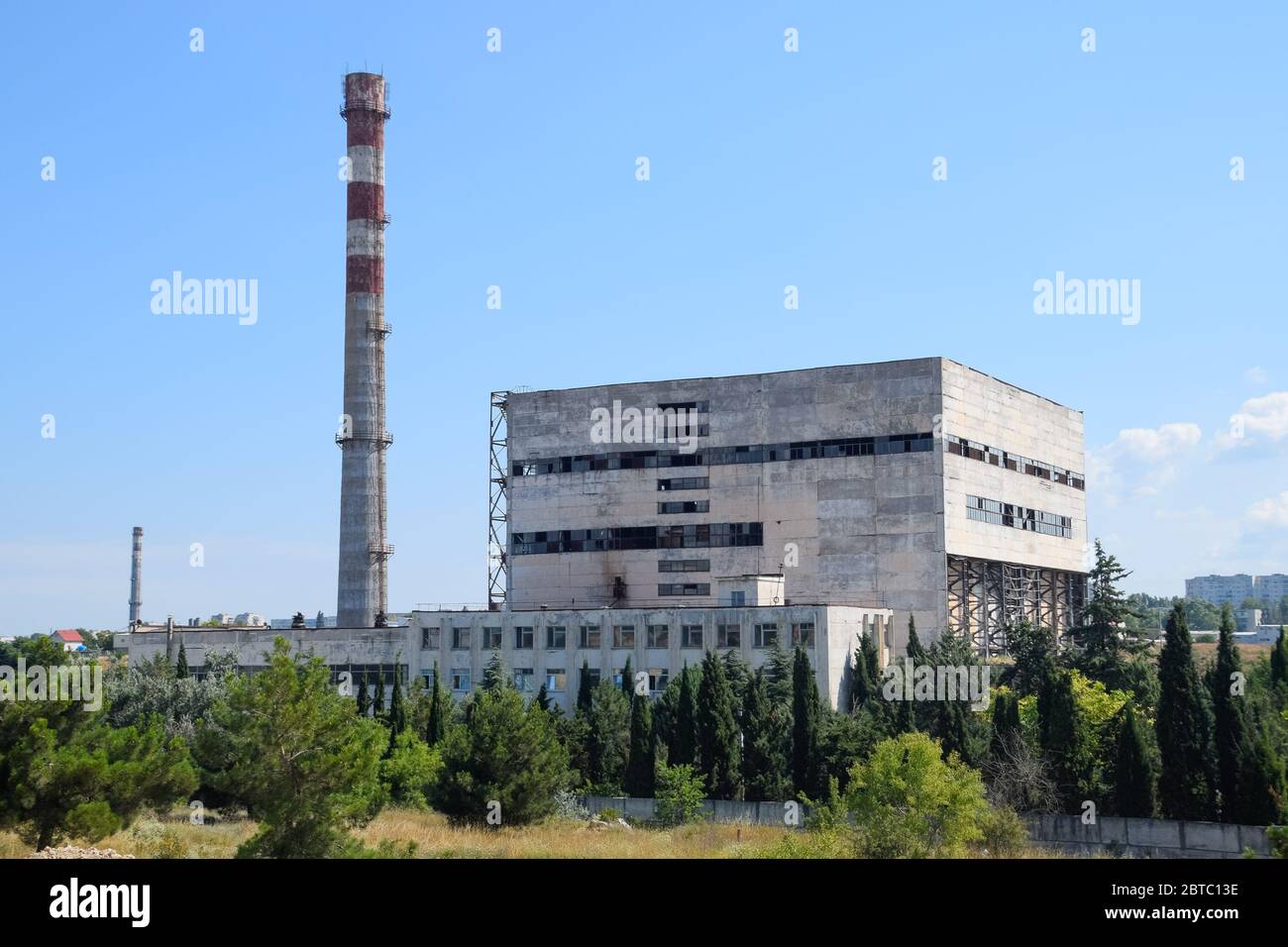 An old Soviet factory with a pipe. Abandoned Soviet industry Stock ...