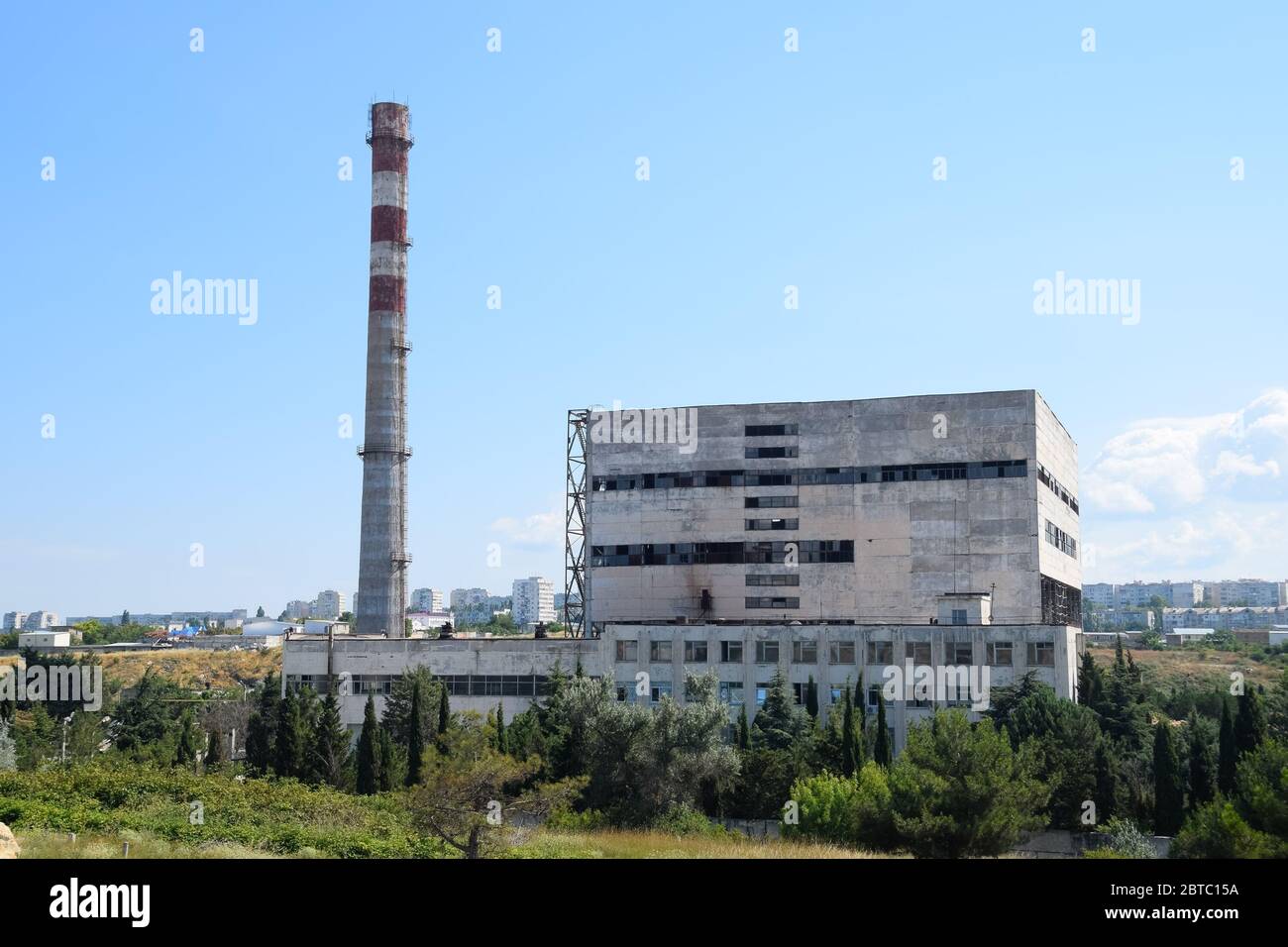 An old Soviet factory with a pipe. Abandoned Soviet industry Stock ...