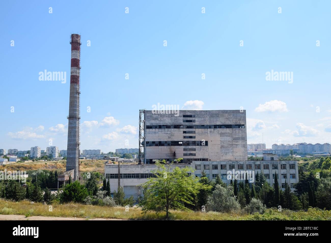 An old Soviet factory with a pipe. Abandoned Soviet industry Stock ...