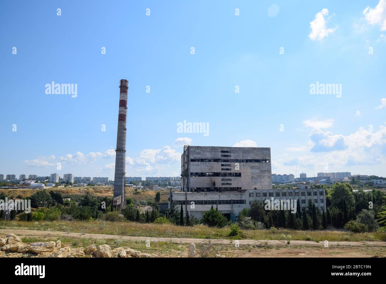 An old Soviet factory with a pipe. Abandoned Soviet industry Stock ...
