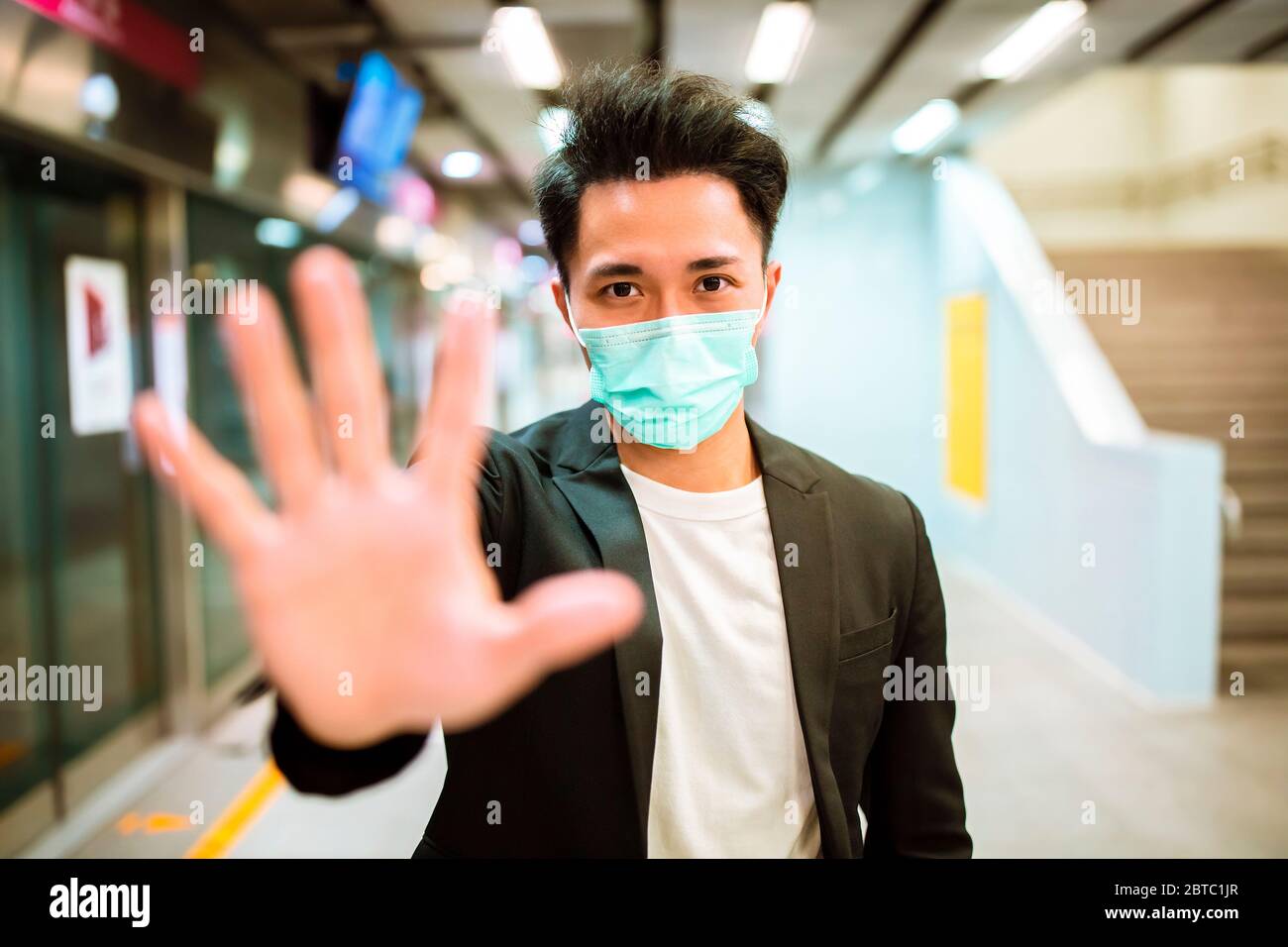Young man wearing sign hi-res stock photography and images - Alamy