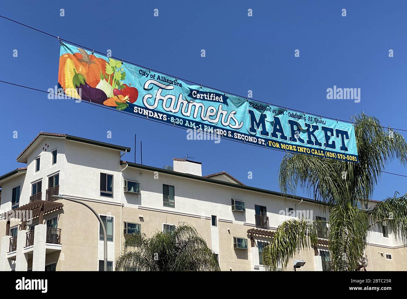 The City of Alhambra Certified Farmer's Market banner on Main St. amid ...