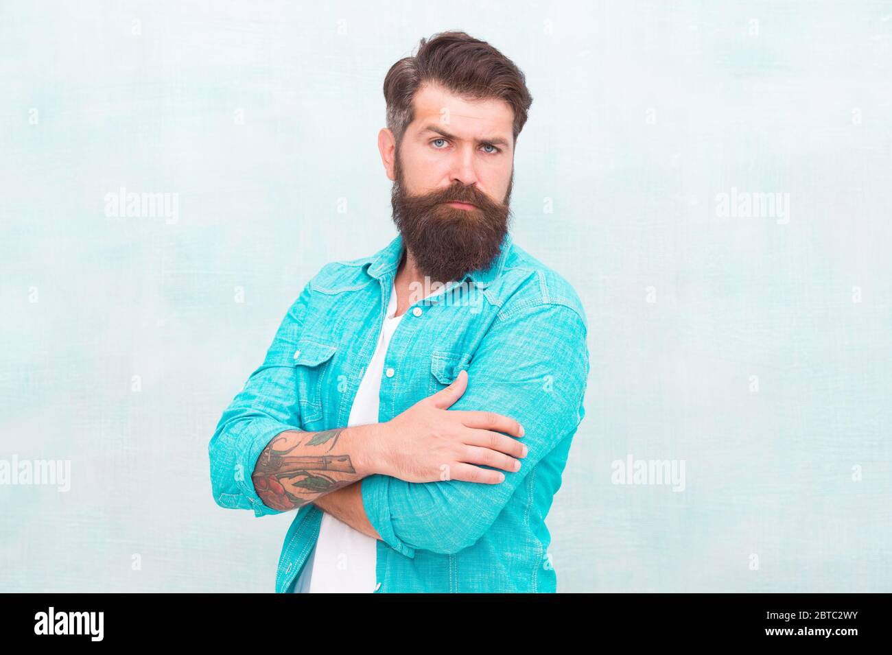 Denim fashion trends. Barbershop fashion. Charismatic barber with beard ...