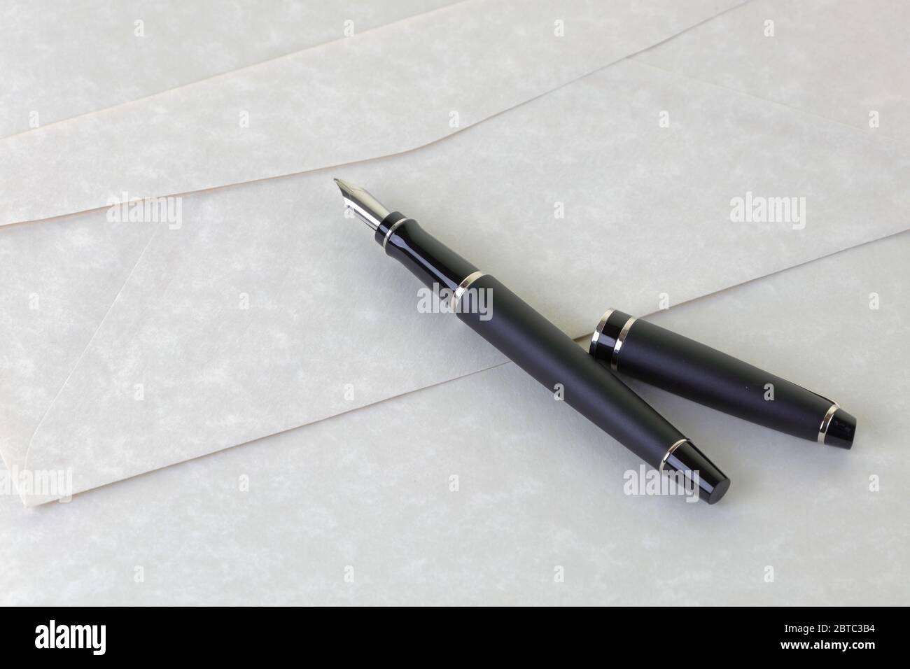 Pen letter and writing paper with envelope Stock Photo - Alamy