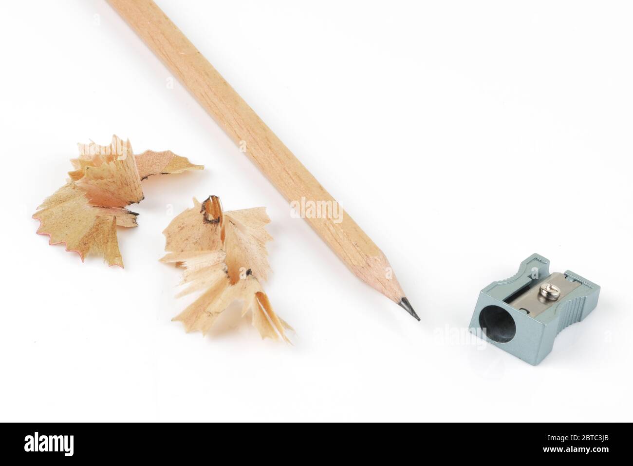 Top view of pencil and sharpener with shavings on white Stock Photo - Alamy