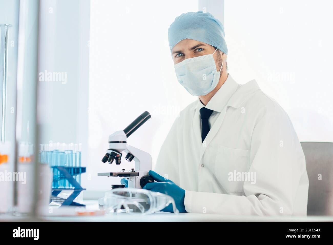close up. scientist looking into the eyepiece of a microscope Stock ...