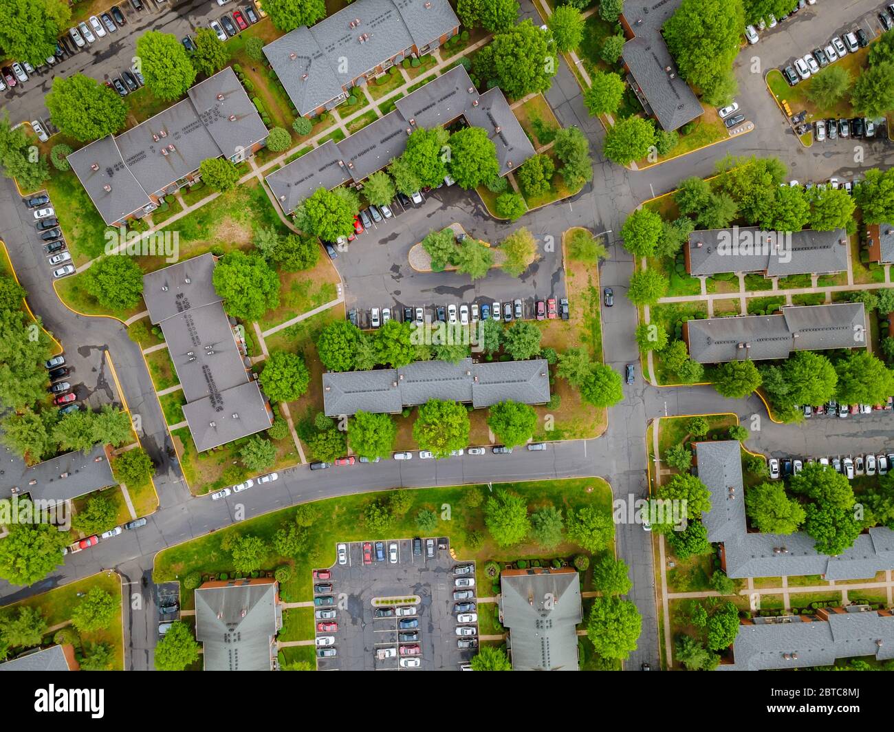 A small town from a height suburban neighborhood with roofs of houses ...