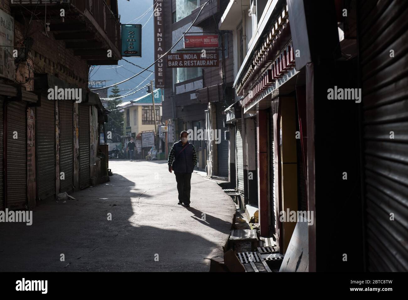 People wearing protective masks and social distancing as a safety ...