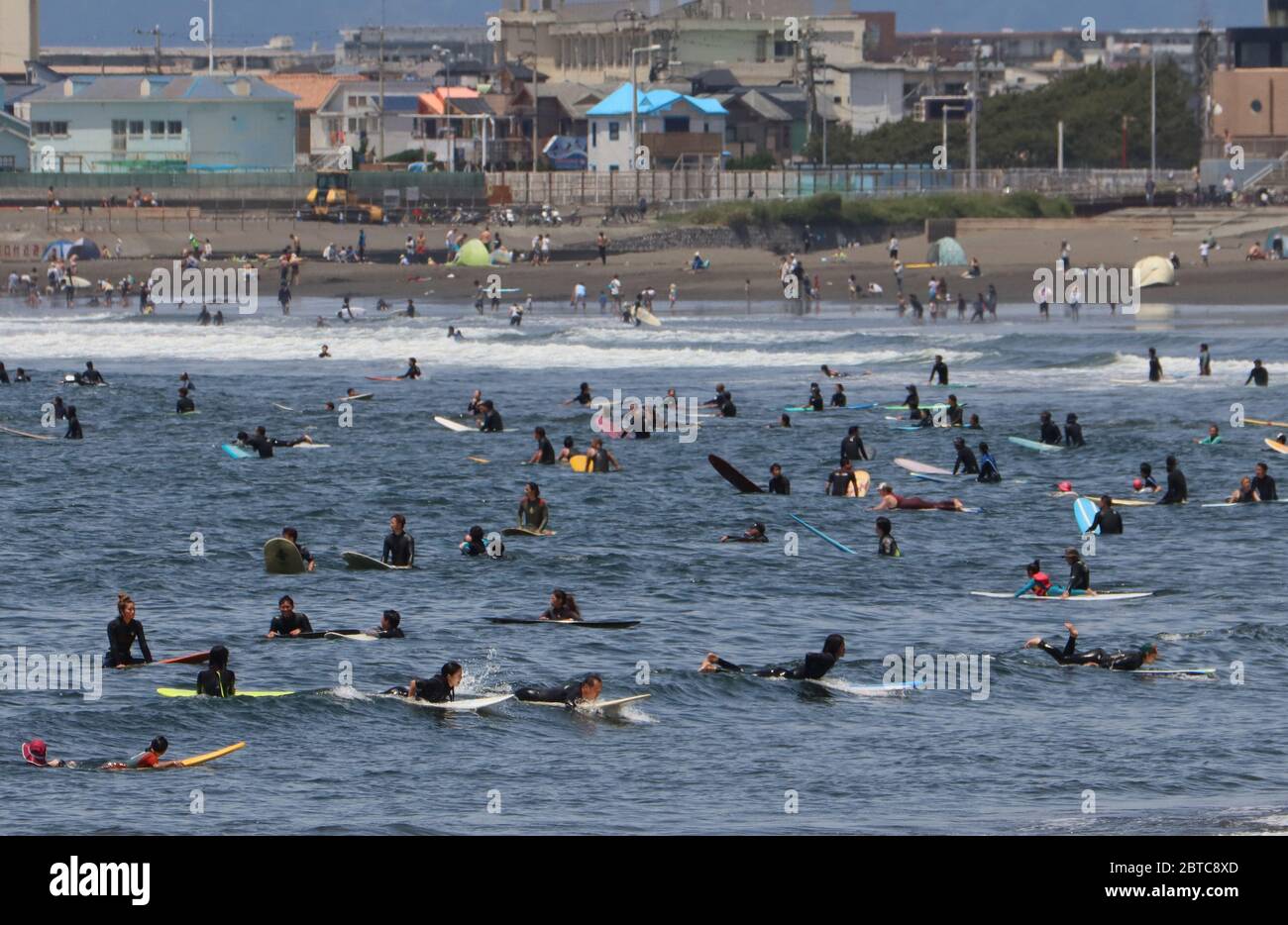 Tokyo, Japan. 24th May, 2020. People enjoy surfing at the Katase ...