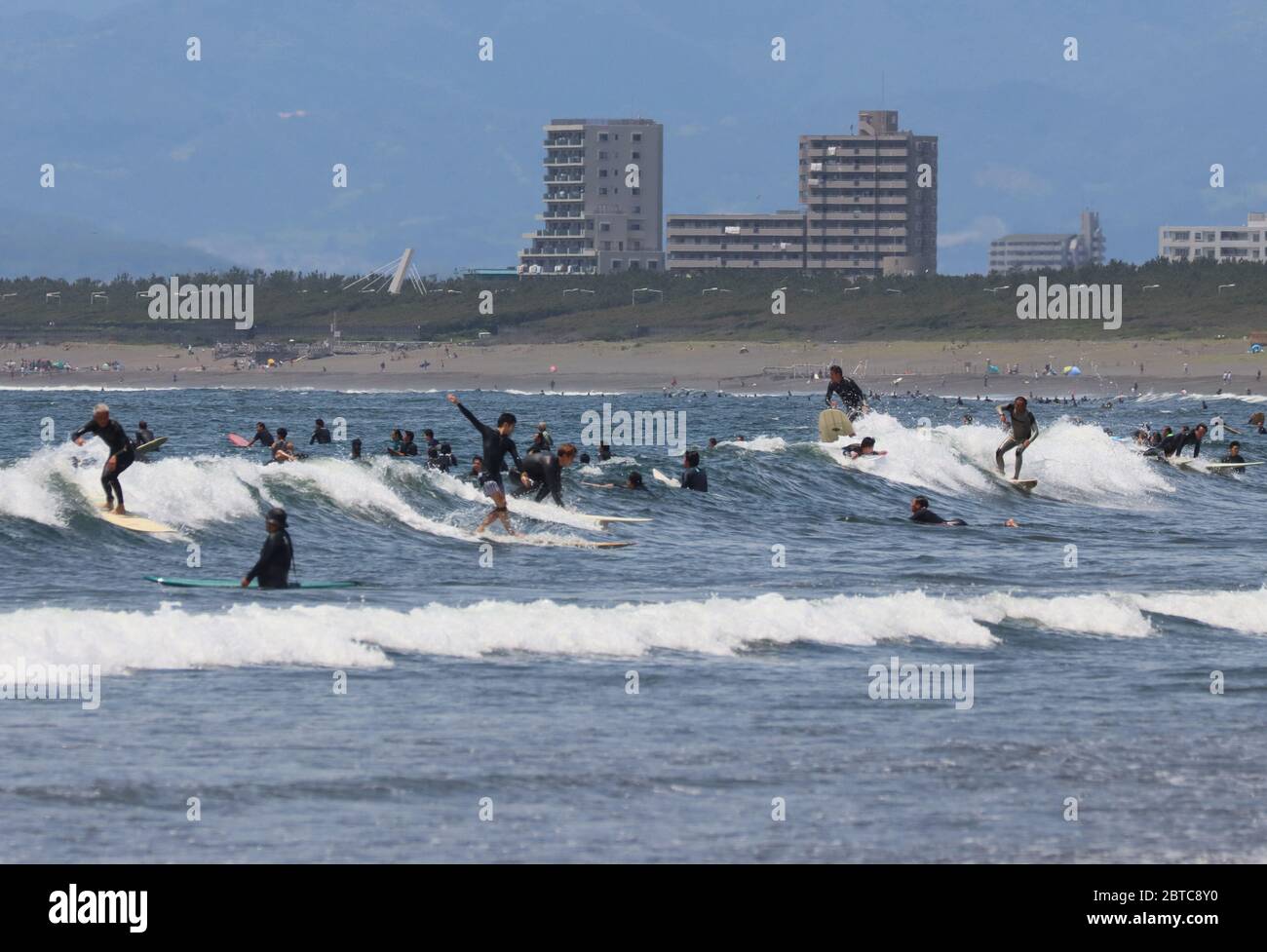 Tokyo, Japan. 24th May, 2020. People enjoy surfing at the Katase ...