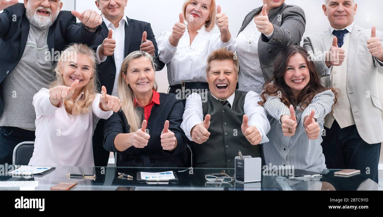 large group of happy employees showing their success Stock Photo - Alamy